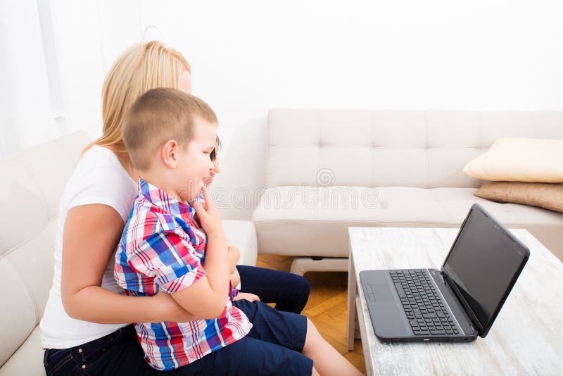 Mother with Her Kids Using a Laptop Computer Stock Photo - Image of ...