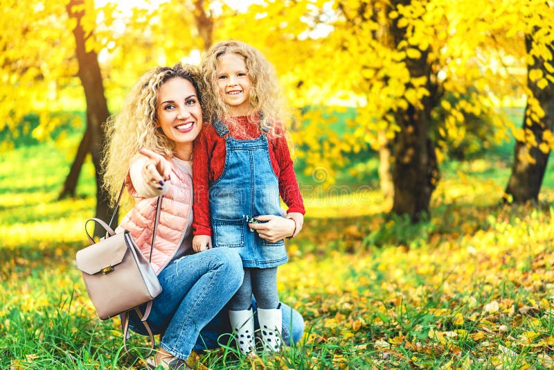 Mother with Her Little Daughter Have Fun in the Park. Stock Image ...