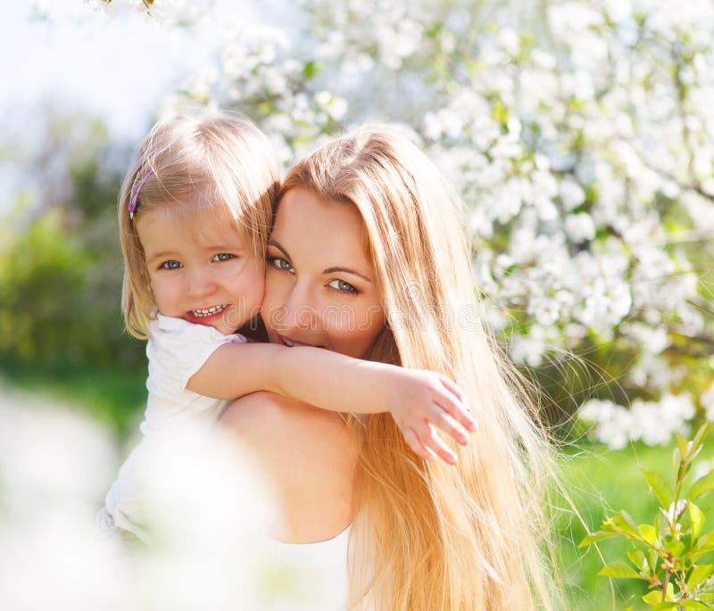Mother and Her Little Daughter in the Spring Day Stock Photo - Image of ...
