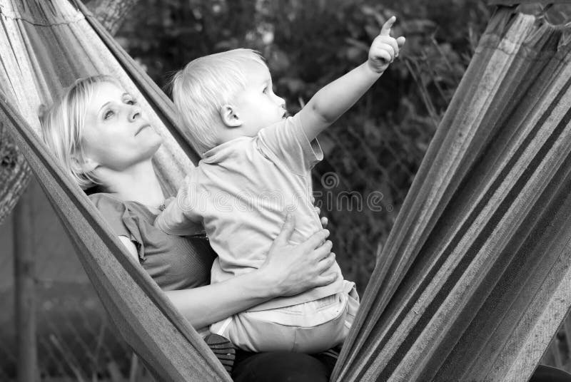 Mother with Her Son Looking at Something Stock Photo - Image of outdoor ...