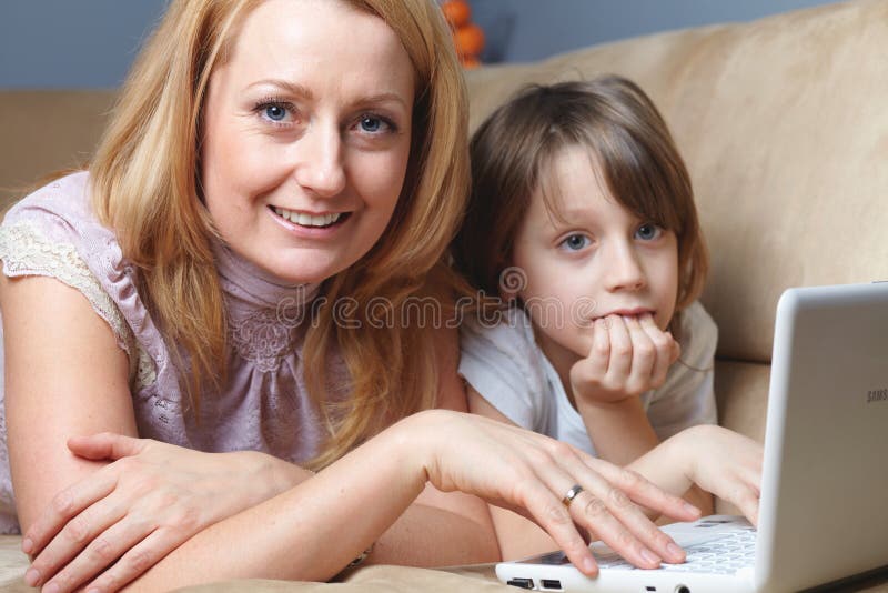Mother with Her Son Work on Netbook Computer Stock Photo - Image of ...