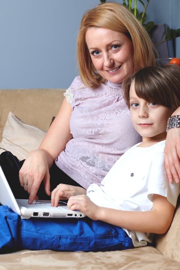 Mother with Her Son Work on Two Netbook Computers Stock Image - Image ...