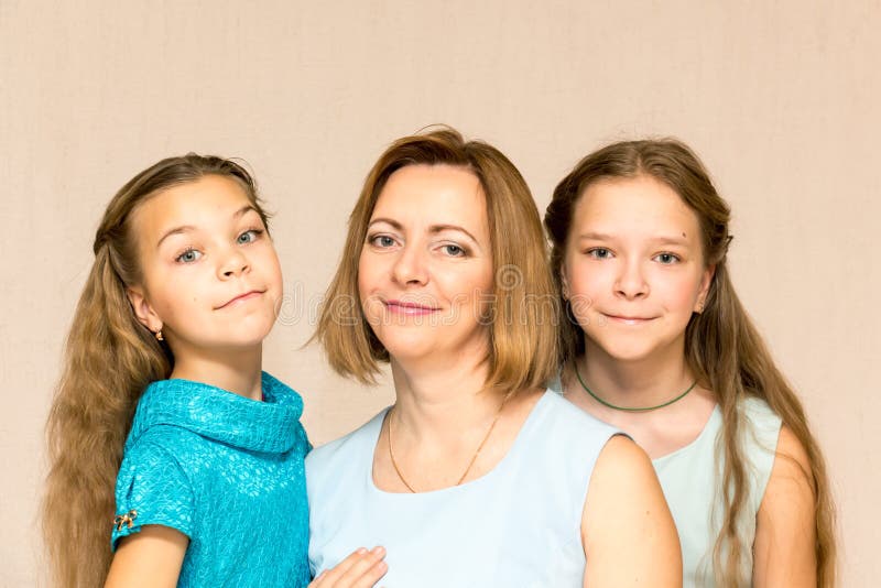 Mother and Her Two Daughters. Family Portrait. Stock Image - Image of ...