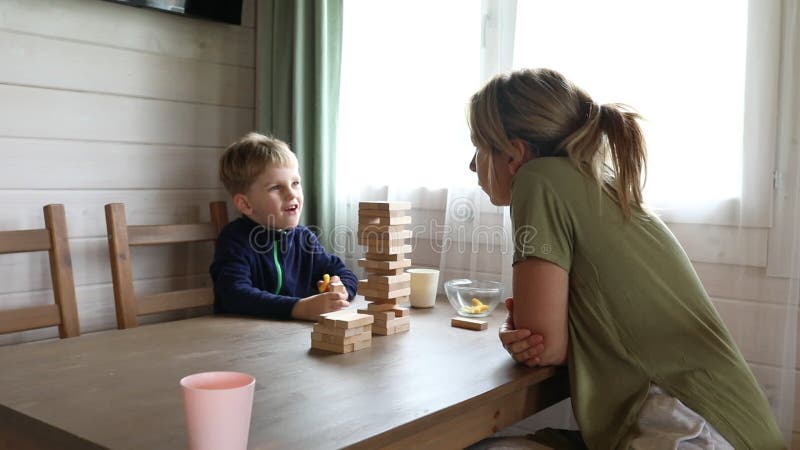 Mother and Son Play Jenga Game at Home Stock Video - Video of together ...