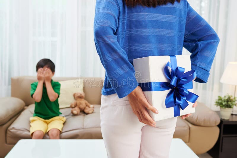 Kid Hiding Birthday Present for Mom, Making Surprise Stock Photo ...