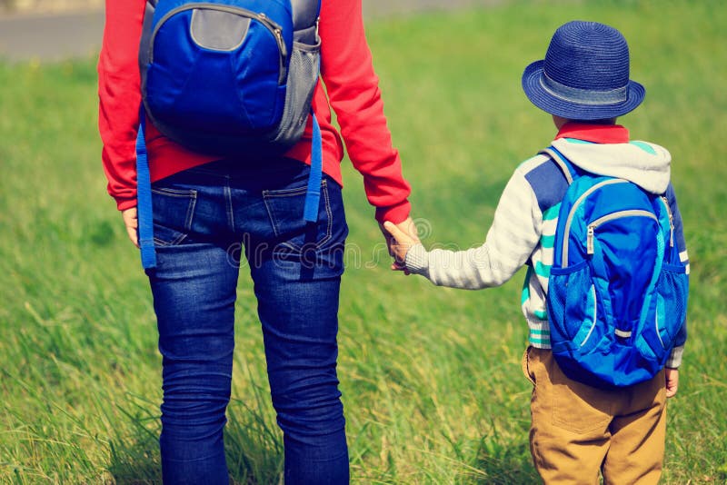 Mother Holding Hand of Little Son with Backpack Stock Photo - Image of ...