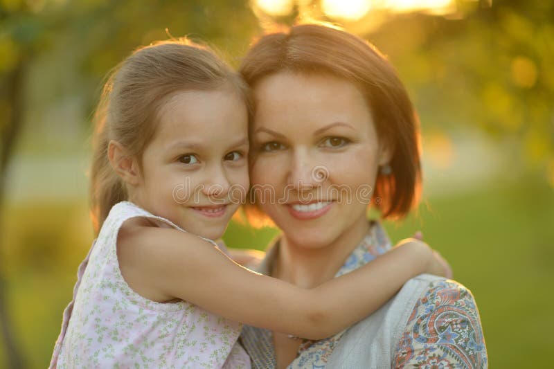Mom Holding Her Daughter In Her Arms Stock Photo - Image of mother ...
