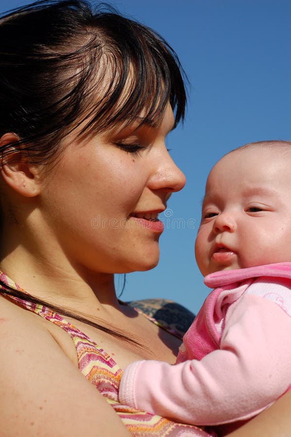 Mother Holding Newborn Baby Stock Photo - Image of expression ...