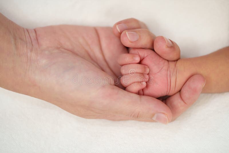 Mother Holding Newborn Baby Hand on Bed Stock Image - Image of people ...