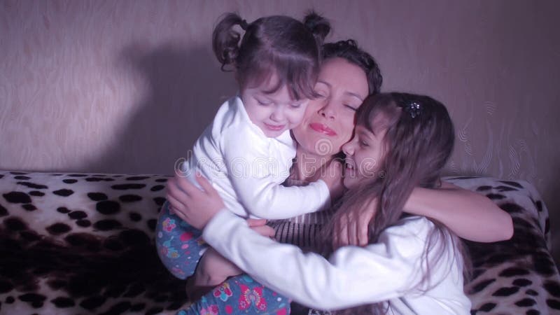 Mother hugging children. stock video. Video of living - 84450411