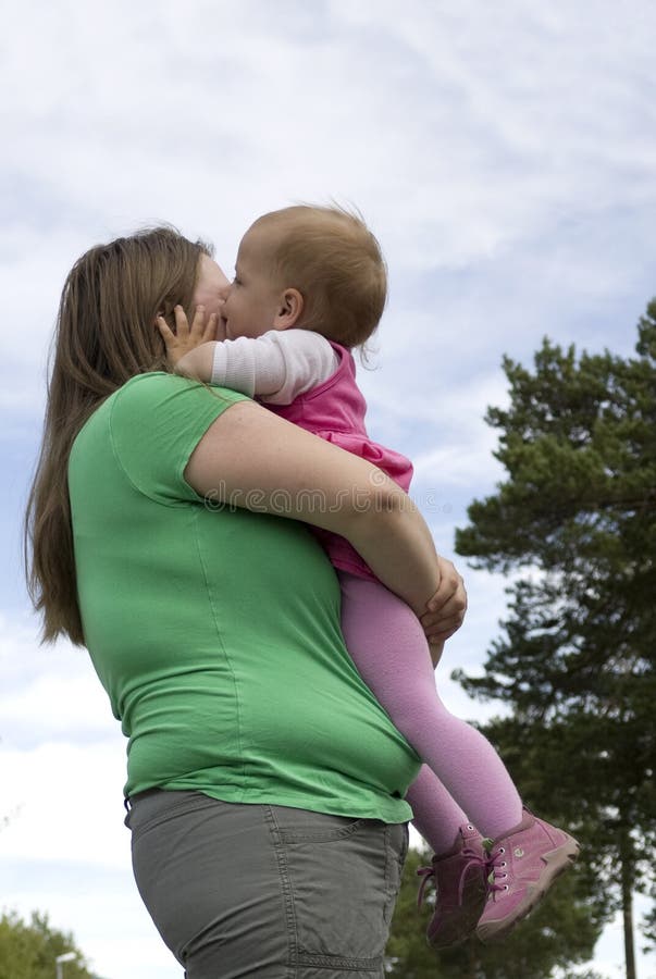 Mother hugging daughter stock photo. Image of overweight - 10752856