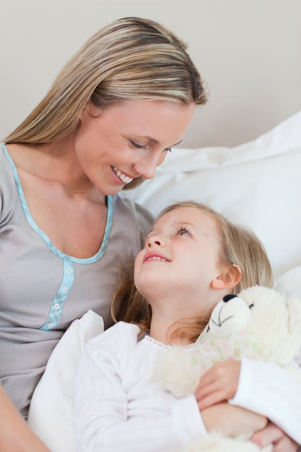 Mother Hugging Her Daughter on the Bed Stock Photo - Image of family ... Mother Hugging Her Daughter on the Bed Stock Photo - Image of family ...