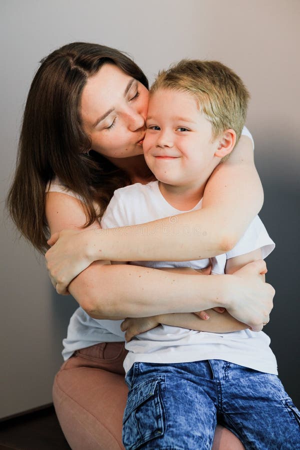 A mother hugs her child stock photo. Image of bench - 186294460