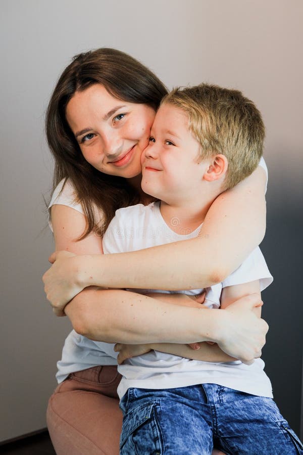 A mother hugs her child stock photo. Image of family - 201711382