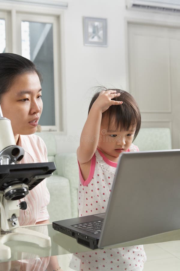 Mother Introduce Technology To Her Daughter Stock Photos - Free ...