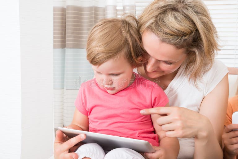 Mother and Kid Using Tablet Together Stock Image - Image of pointing ...
