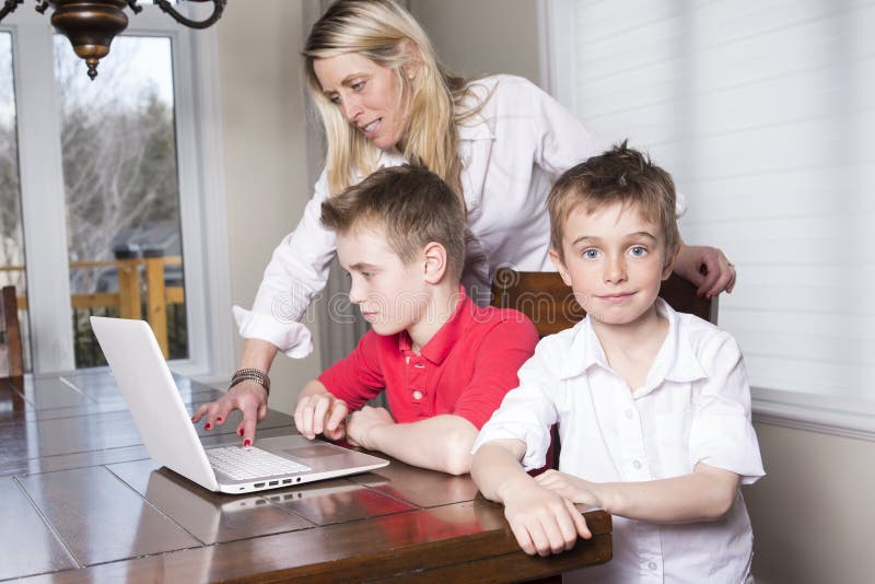Mother with Kids Playing on Laptop Computer Stock Photo - Image of ...
