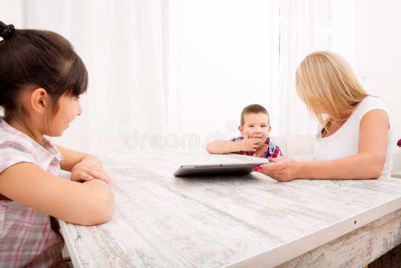 Mother and Kids with a Tablet PC Stock Photo - Image of happy, online ...