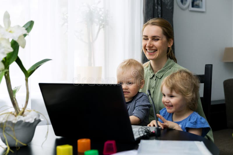 Mother with Kids Using Laptop Computer and Having Fun Together Stock ...