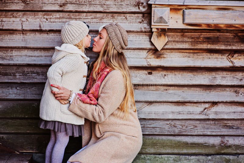 Mother Kissed Her Daughter at Wooden House Stock Image - Image of house ... Mother Kissed Her Daughter at Wooden House Stock Image - Image of house ...