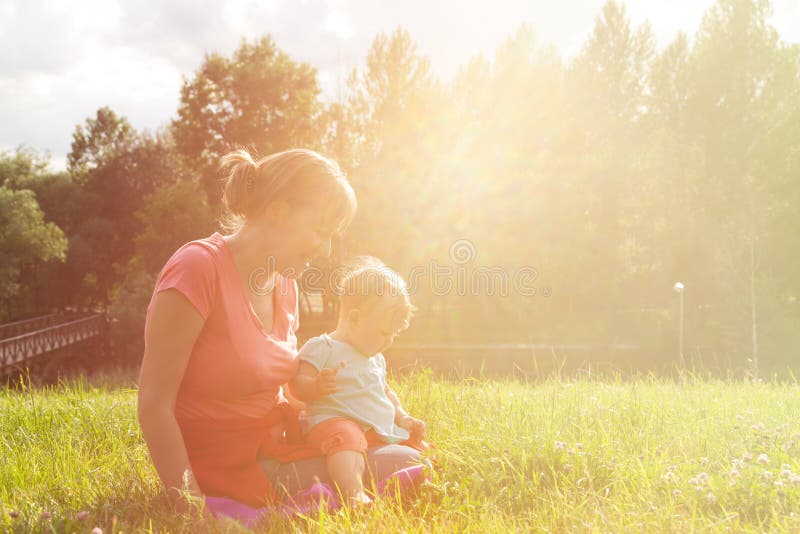 Mother and Little Daughter Play at Sunset Stock Photo - Image of baby ...