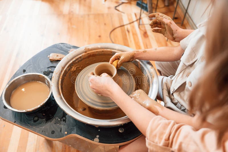 Mother with Little Girl Making Ceramic Pot in the Workshop Stock Photo ...