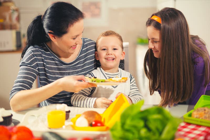 Mother Making Breakfast for Her Children Stock Image - Image of ...