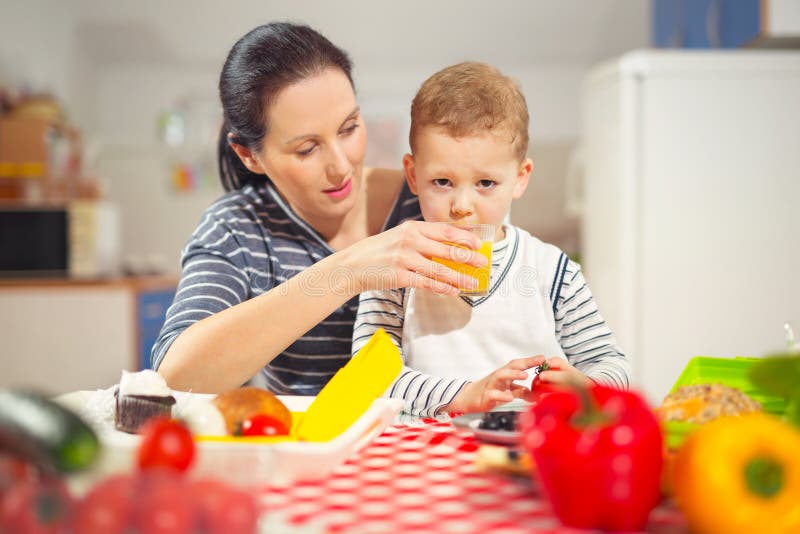 Mother Making Breakfast for Her Children in the Morning at Home Stock ...