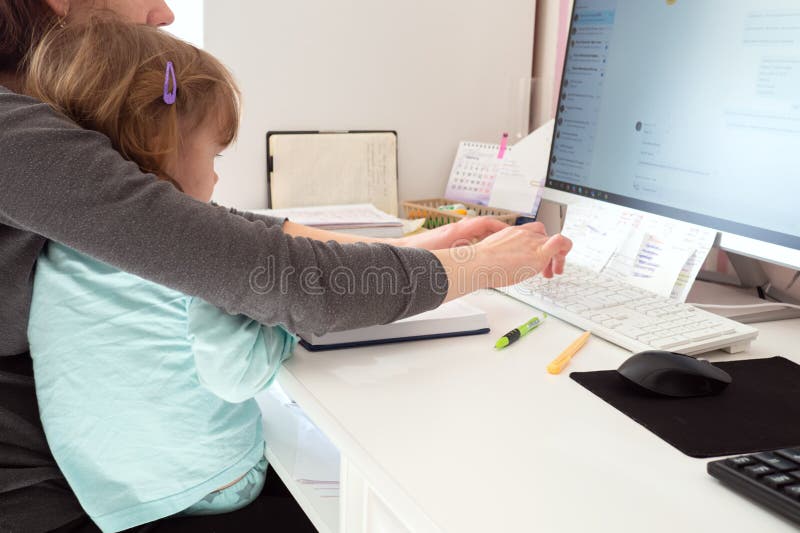 Mother Multi-tasking, Holding Girl Kid and Using Computer at Home ...