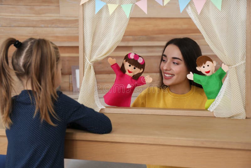 Mother Performing Puppet Show for Her Daughter at Home Stock Image ...