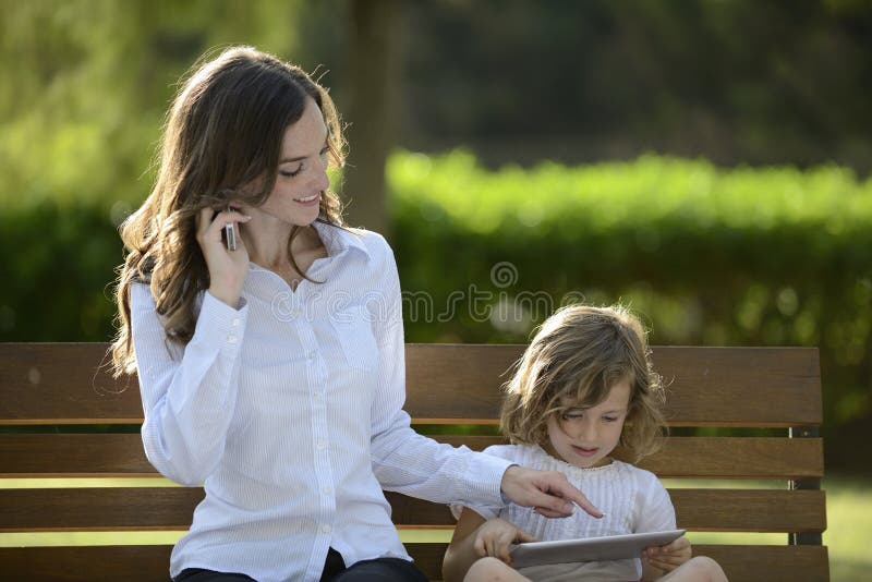 Mother on Phone with Daughter Using Digital Tablet Stock Photo - Image ...