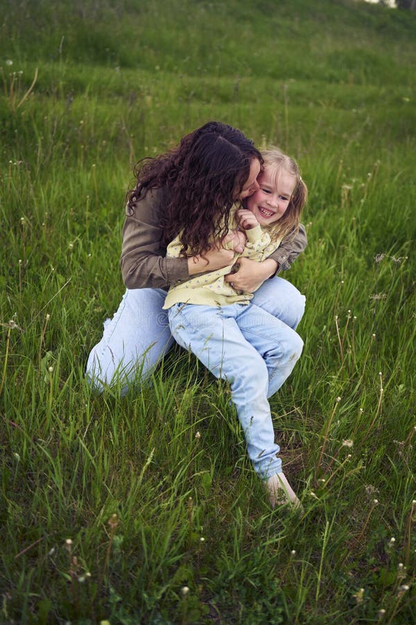Mother Plays Catch Up with Her Daughters Stock Image - Image of catch ...