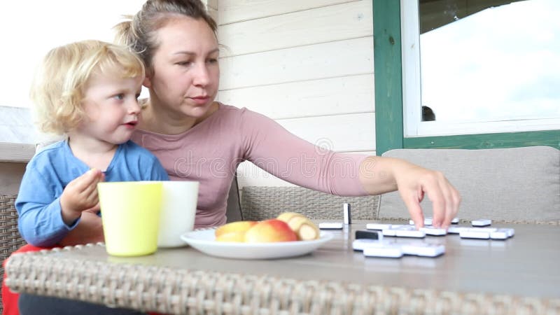 Mother and Sons Playing Dominoes on a Terrace Stock Footage - Video of ... Mother and Sons Playing Dominoes on a Terrace Stock Footage - Video of ...