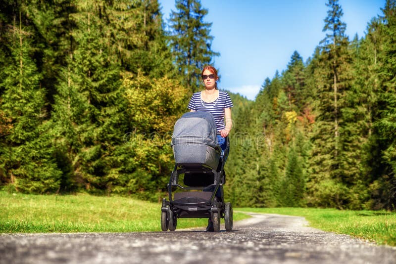 Mother with pram stock image. Image of care, child, outdoor - 162807639