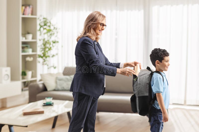 Mother Putting Books Backpack Stock Photos - Free & Royalty-Free Stock ...