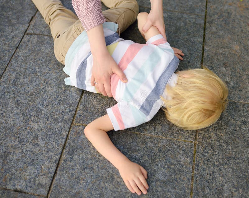 Mother Raises a Fallen Child. Injury Stock Photo - Image of comforting ...
