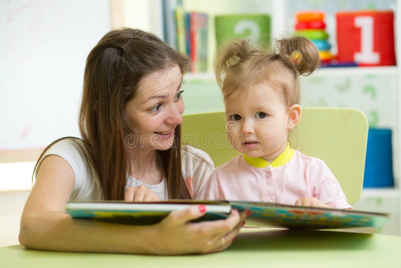Mother Reading Book Her Child in Nursery Stock Image - Image of baby ...