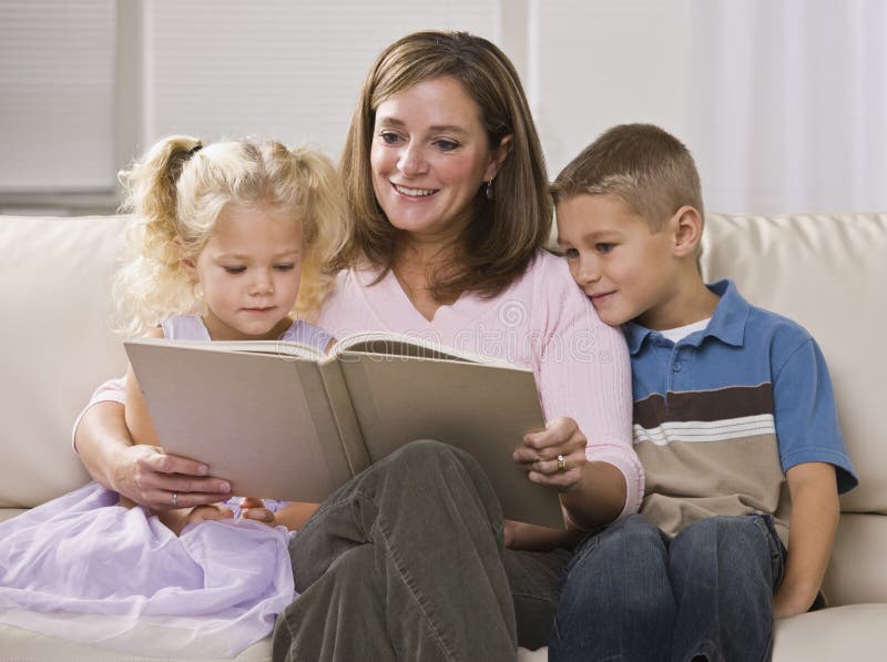 Mother Reading to Children stock photo. Image of apartment - 10320652