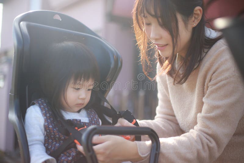 Mother Riding a Child on a Bicycle Stock Image - Image of happy, bright ...
