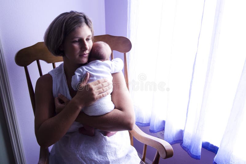 Mother Rocking Newborn Baby by Window Stock Photo - Image of curtain ...