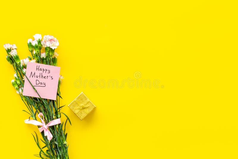 Mother`s Day Congratulations. Carnations and Gift Box on Yellow ...