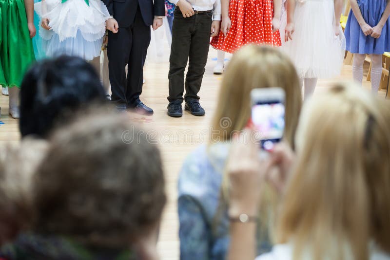 Mother shoot on smartphone stock image. Image of primary - 69005329