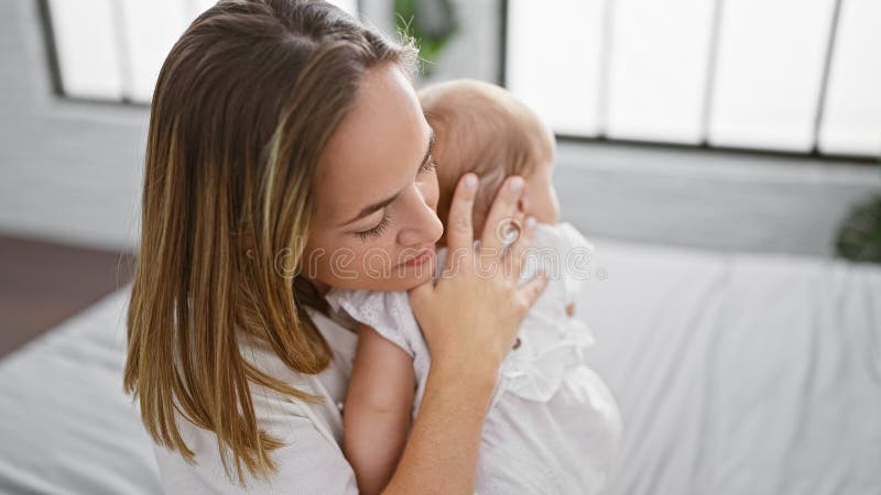 Mother Sitting on Bed Hugging Daughter at Bedroom Stock Image - Image ...