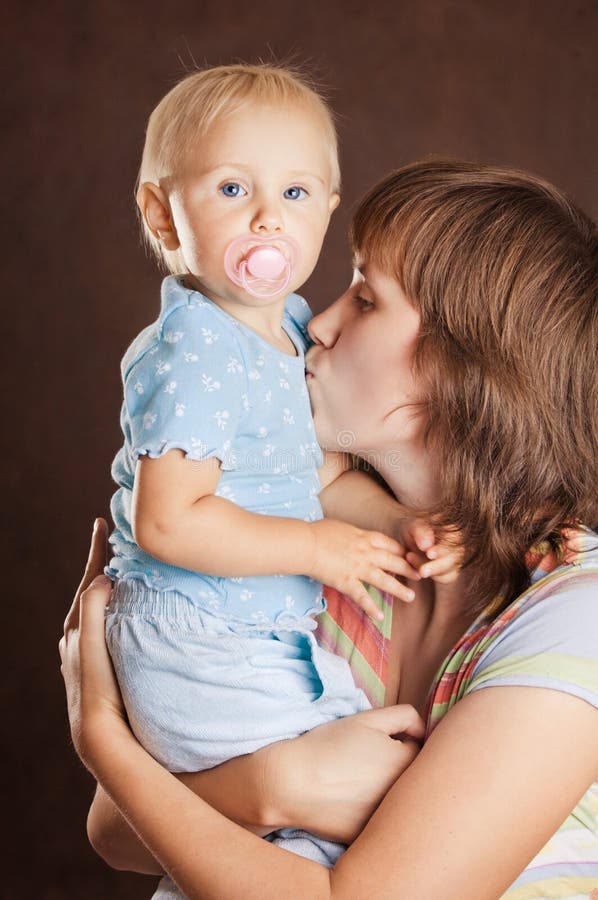 Mother with a small baby stock image. Image of mother - 10915059