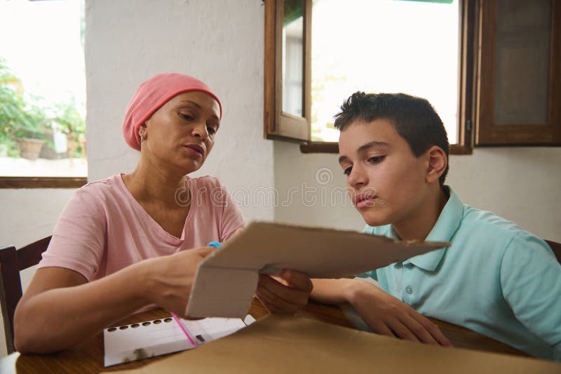 Mother and Son Collaborating on a Project at a Home Table Stock Photo ...