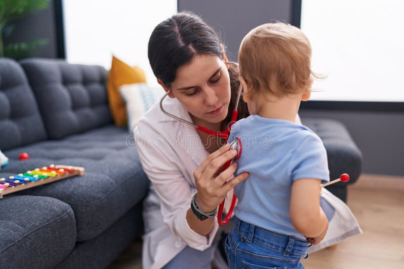 Mother and Son Doctor Examining Child at Home Stock Image - Image of ...