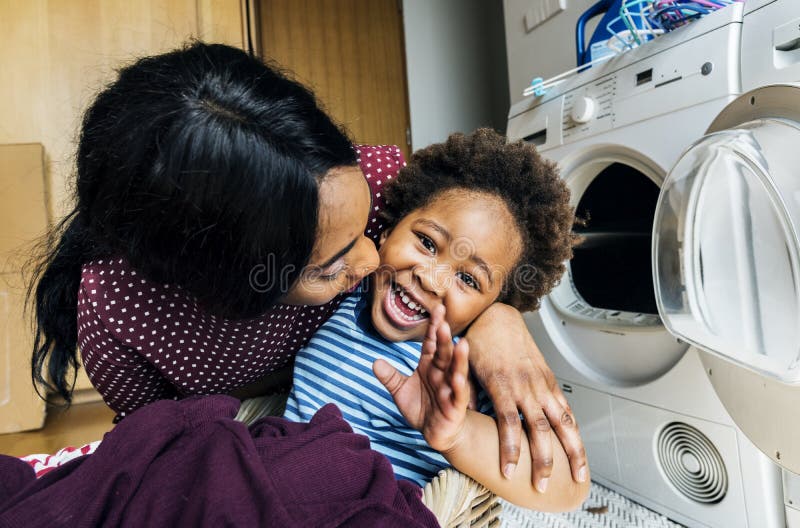 Mother and Son Doing Housework Together Stock Photo - Image of machine ...