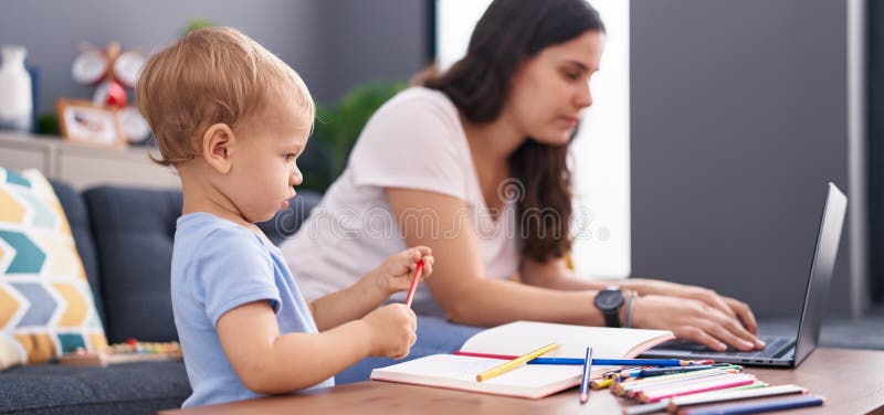 Mother and Son Drawing on Notebook Using Laptop at Home Stock Photo ...