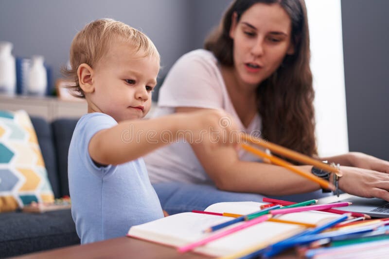 Mother and Son Drawing on Notebook Using Laptop at Home Stock Photo ...