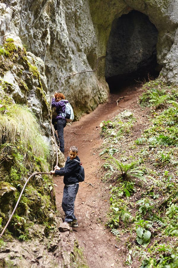 Mother and Son Getting Out from a Cave Stock Image - Image of path ...
